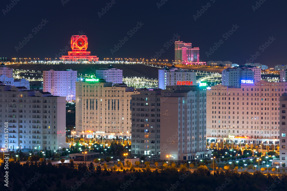 Ashgabat, Turkmenistan skyline at night. Wedding Palace, a civil ...