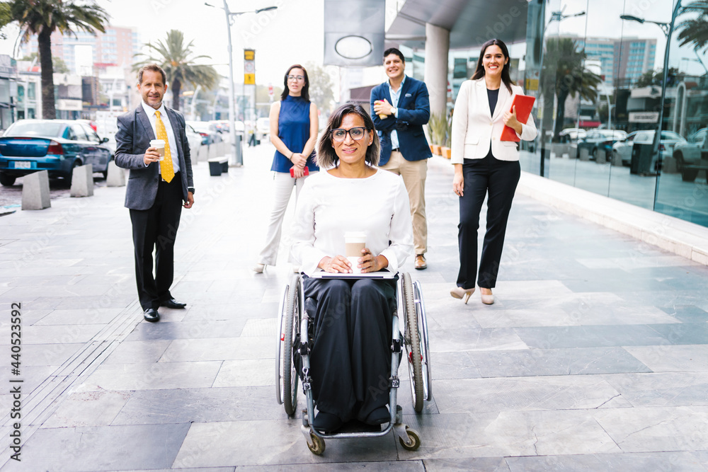 Latin disabled transgender female and her business team taking coffee ...