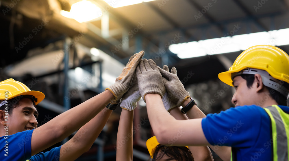 Unity and teamwork concept. team standing hands together. Professional ...