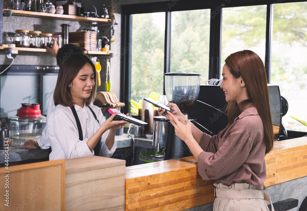 Customer order the hot coffee and payment with smartphone scan. Stock ...