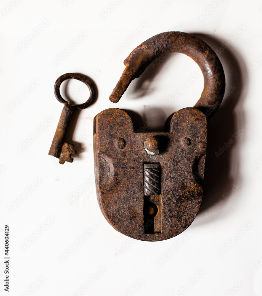 vintage lock and key on white background, old textured lock and key ...
