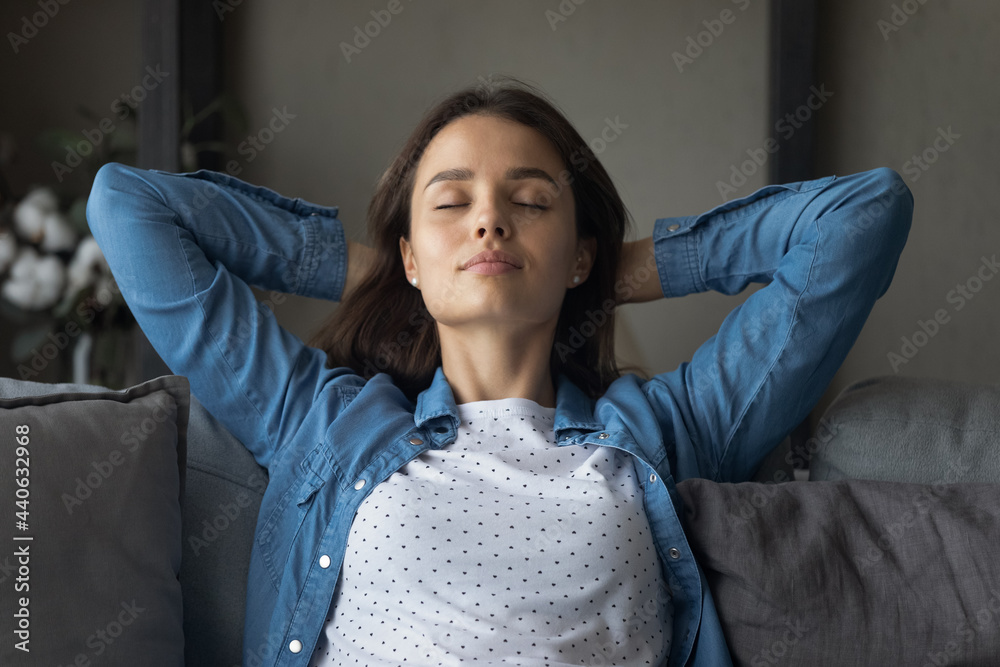 Head shot happy relaxed attractive young woman sleeping on cozy sofa ...
