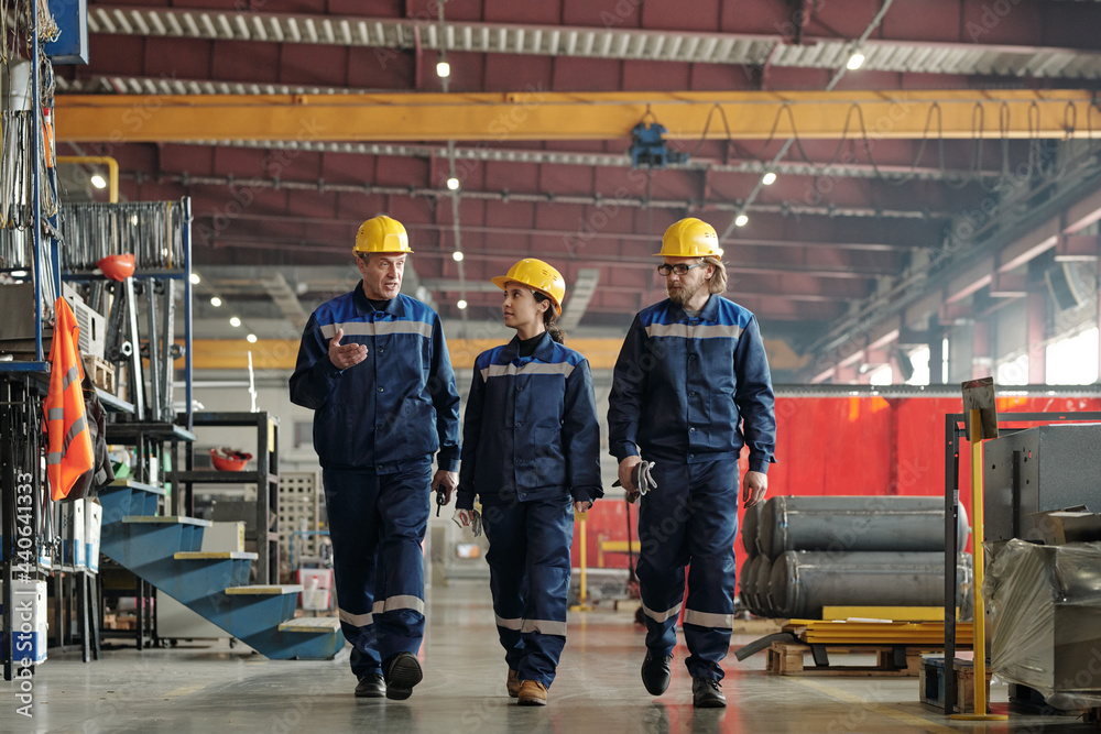 Factory foreman explaining tasks to employees Stock Photo | Adobe Stock