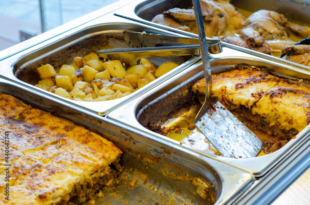 Soft focus of various dishes in a food display counter at a buffet ...