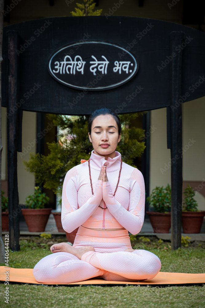 Zdjęcie Stock: Young beautiful yogi woman practicing yoga, sitting in ...