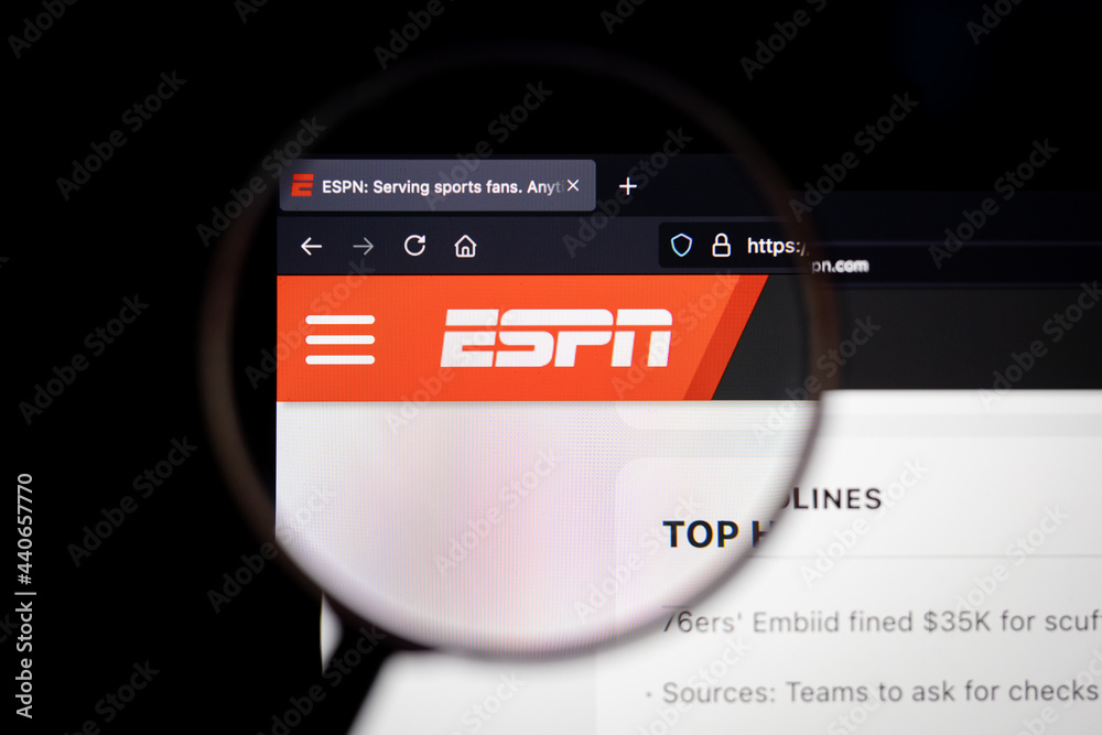 ESPN company logo on a website seen on a computer screen through a ...