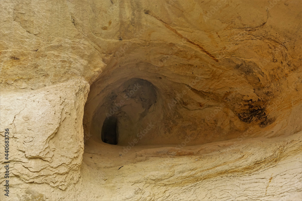 The cave was carved into the sandstone cliff of Cappadocia. Rounded ...