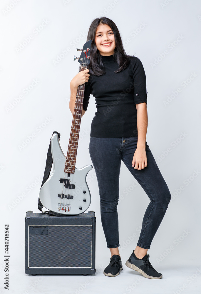 Portrait shot of an attractive young Thai-Turkish teenager standing and ...