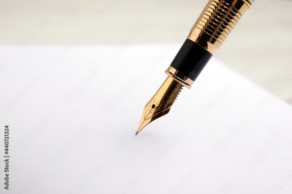 Writing with fountain pen on sheet of paper, closeup. Space for text ...