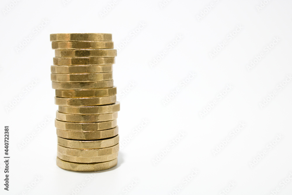 Single stack of one pound coins isolated on white background, with copy ...