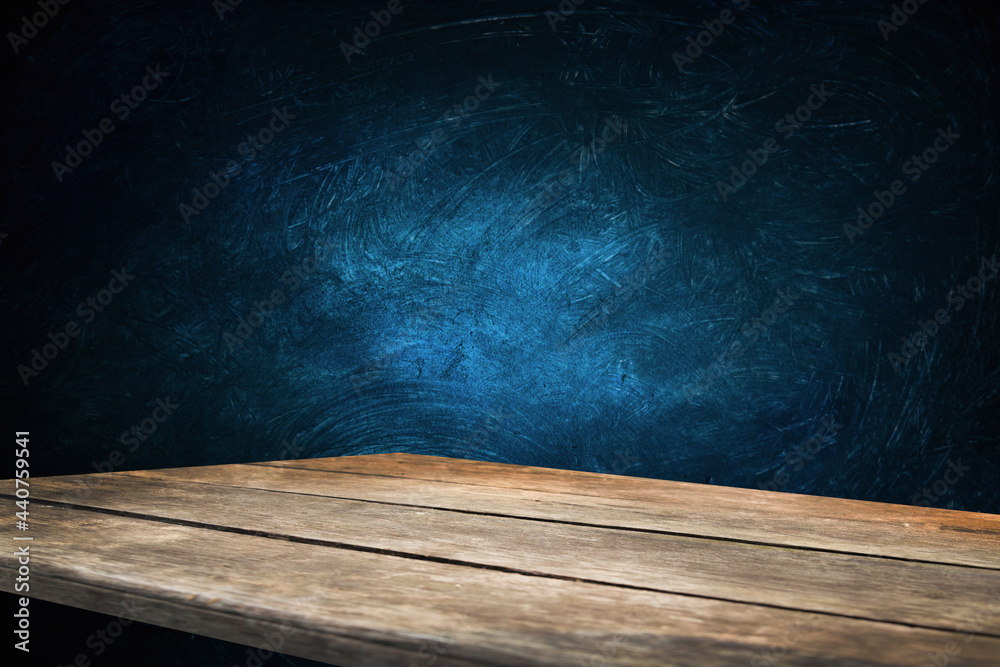 empty dark blue background with empty table for your product montage ...