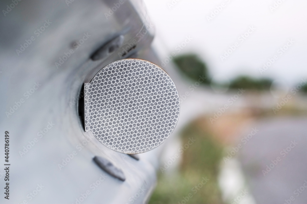 White reflective sign warn curve at night on the steel guard rail on ...