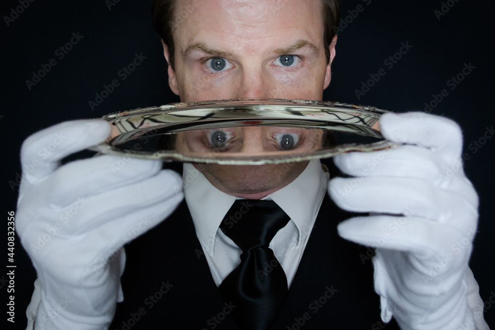 Portrait of Butler or Waiter in White Gloves Holding Silver Serving ...