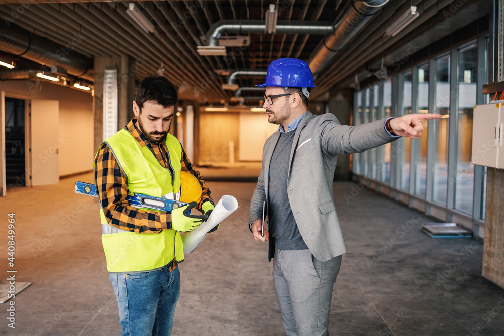 Angry supervisor getting fired construction worker. Construction site ...