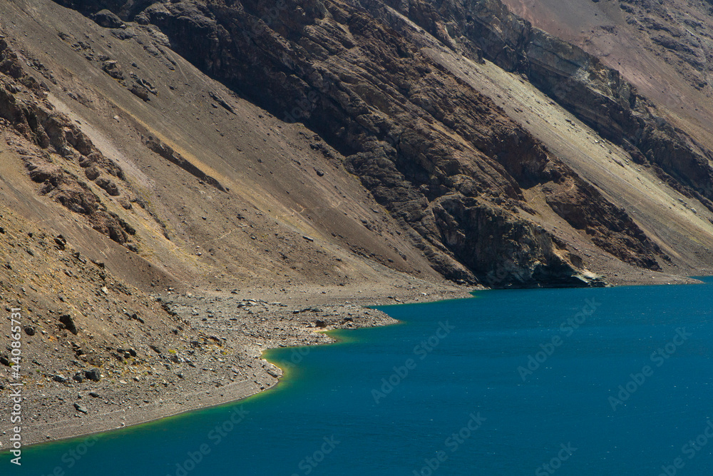 The turquoise color water laker high in the Andes cordillera. The ...