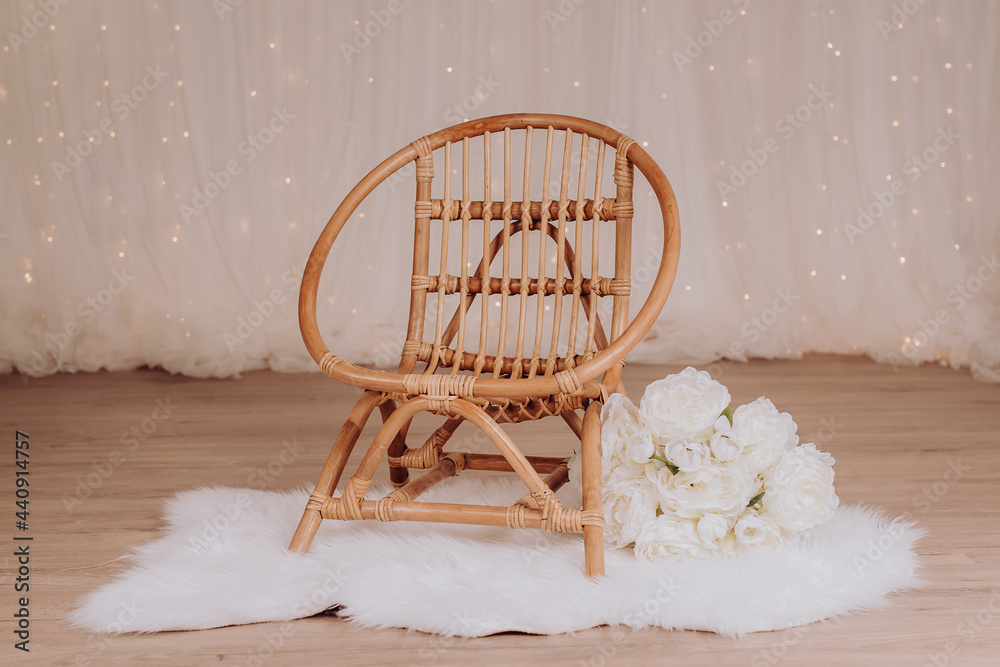 A vintage chair for a toddler to sit during a photo session in a photo ...