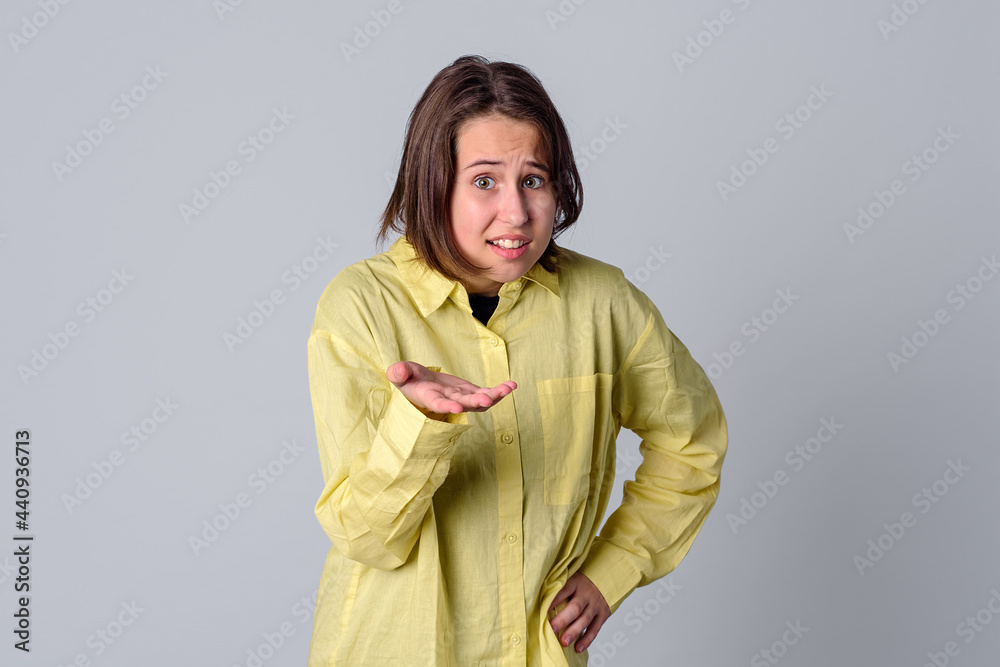 Reluctant teen girl shrugging raise hand full disbelief dismay ...