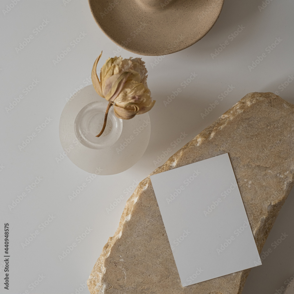 Flat lay of blank paper sheet card with mockup copy space and flower ...
