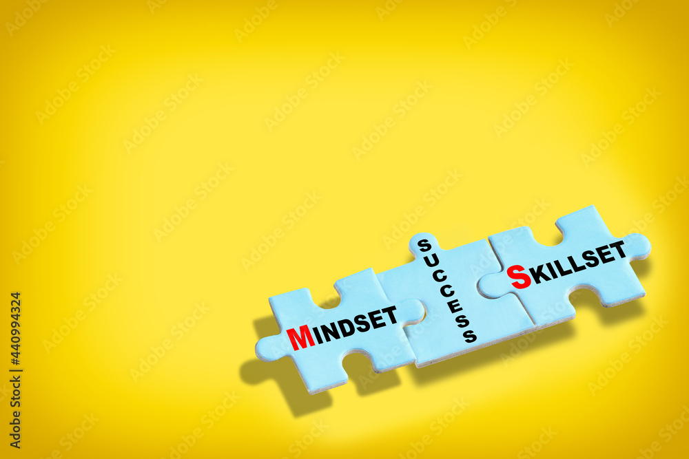 Mindset, skillset and success written on blue puzzle isolated on yellow ...