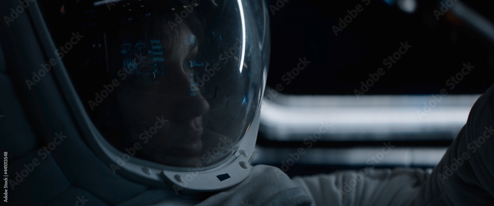 Portrait of Caucasian female astronaut inside spaceship cockpit. Sci-fi ...