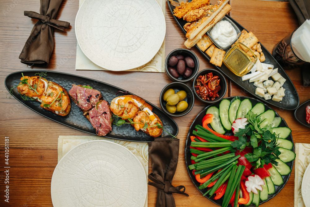 Top view of a perfectly plated dining table just for two. It's full of ...