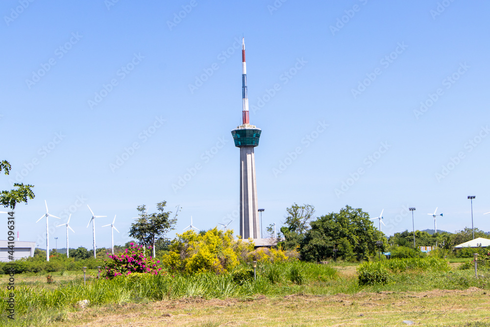 Remote photo Lighthouse and traffic control tower cargo ship sailing as ...