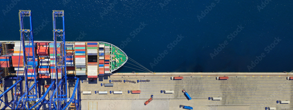Aerial top down ultra wide photo of industrial container ship loading ...