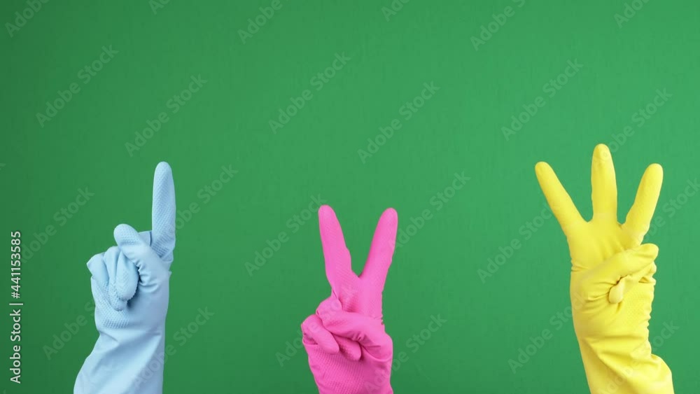 Hands counting from 1 to 3. Three hands with protective rubber gloves ...