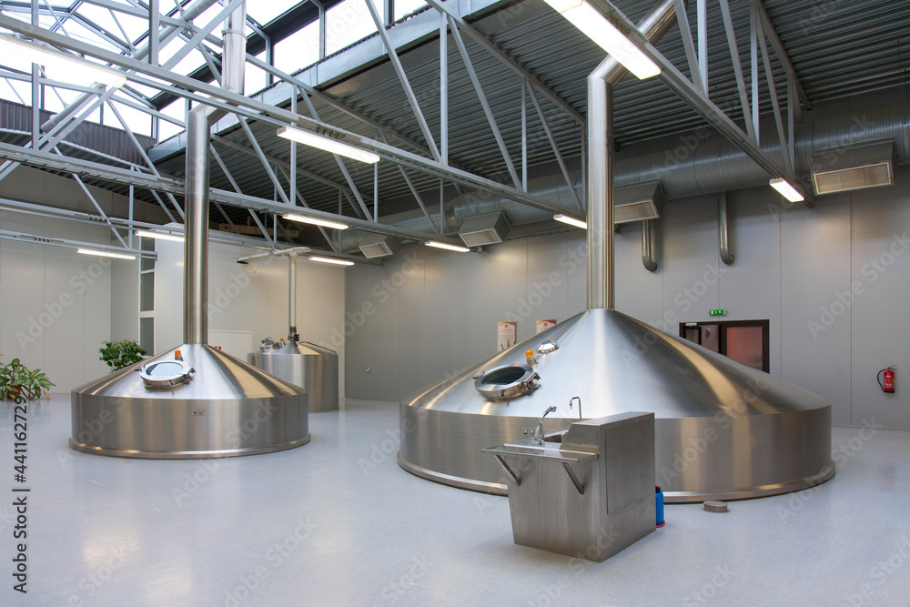 Interior of brewery, large steel storage tanks for brewing beer. Stock ...