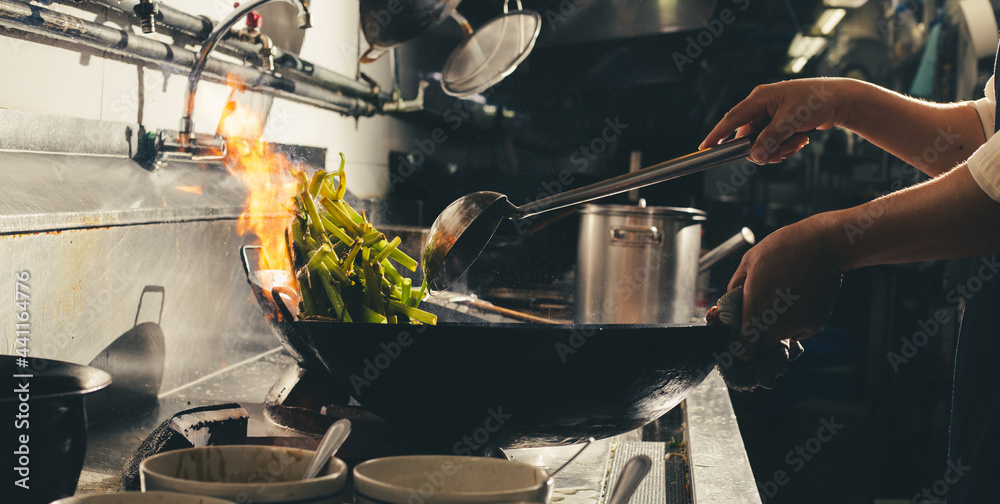 Chef Stir Fry Busy Cooking In Kitchen. Chef Stir Fry The Food In A ...