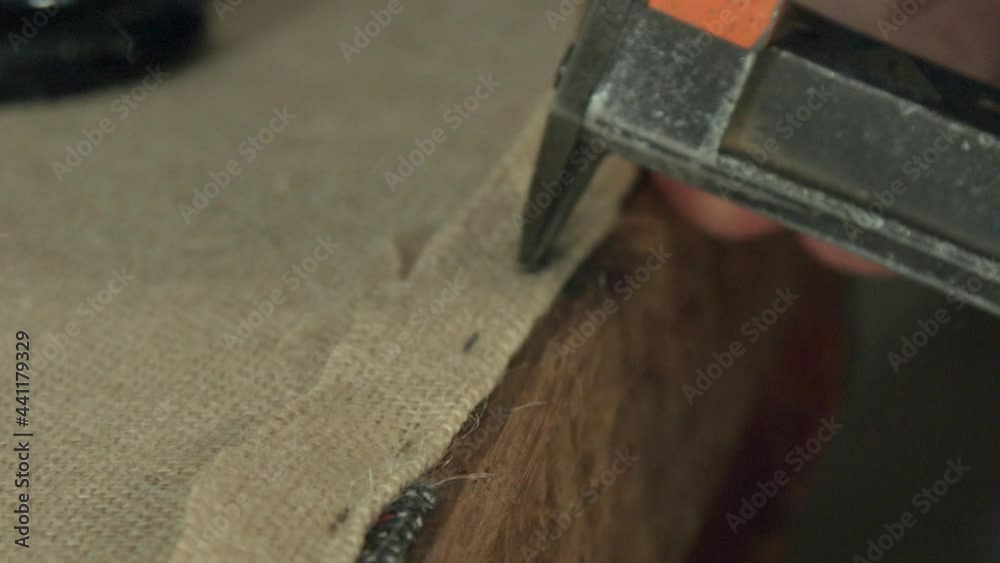 Man stapling on furniture upholstery, Kenilworth, Coventry, UK Stock ...