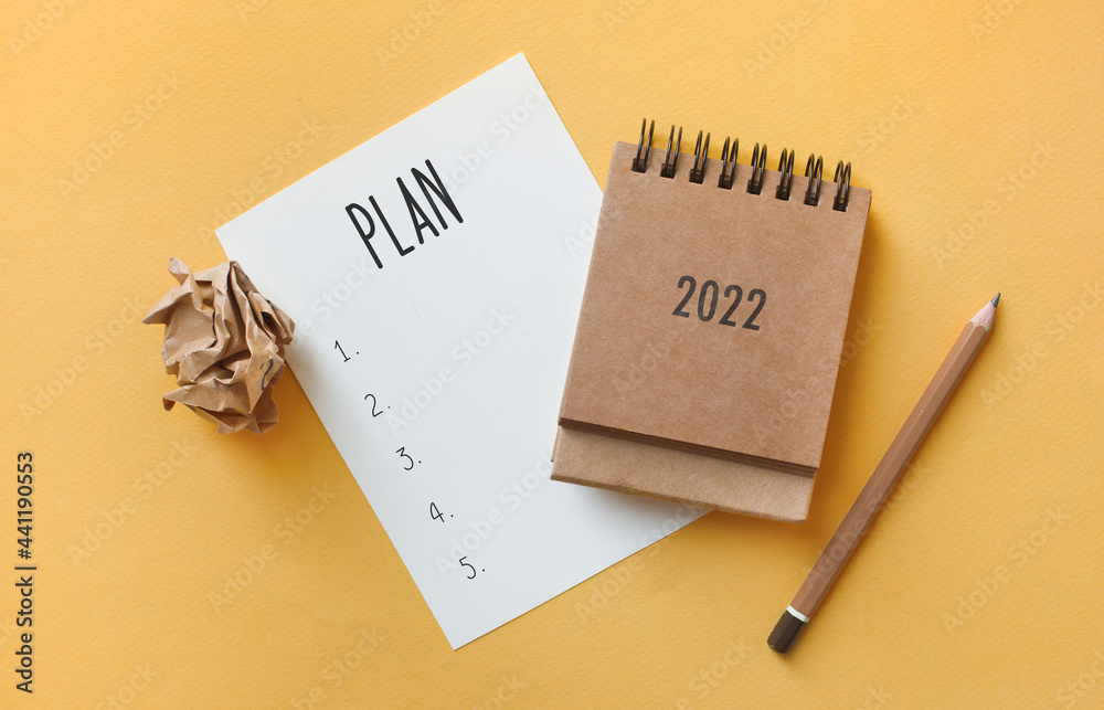plan for 2022. Calendar , smart watch and office accessories on the ...