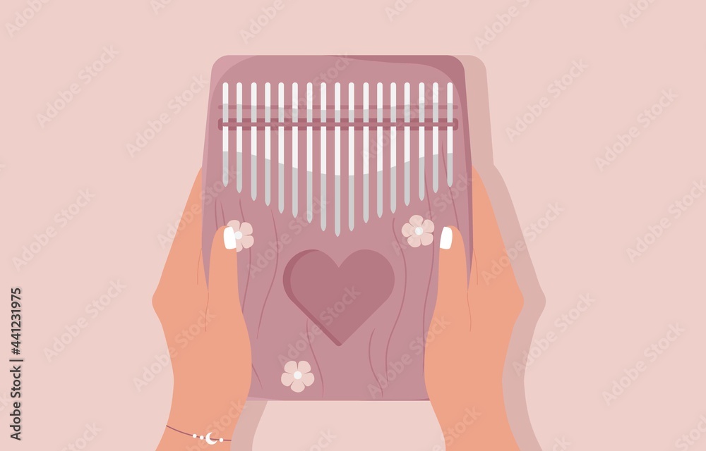 Hands hold kalimba. Mbira or thumb piano. African traditional musical ...