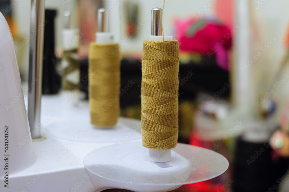 Spool of thread on the back of the four thread overlock. Selective ...