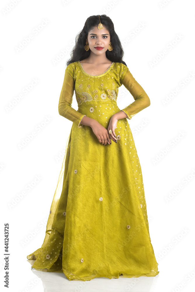 Portrait of beautiful traditional Indian girl posing on white ...