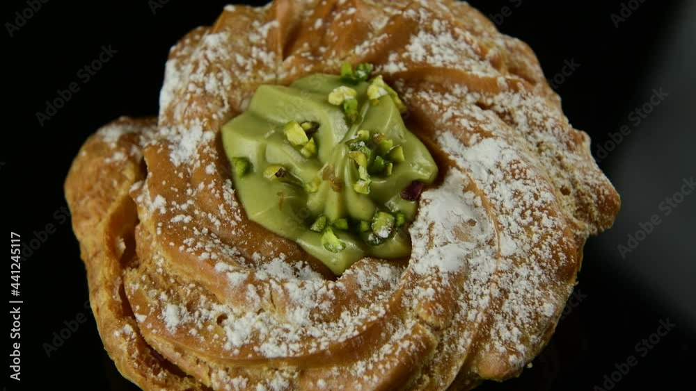 Close up delicious italian desserts with pistachio cream called zeppole ...