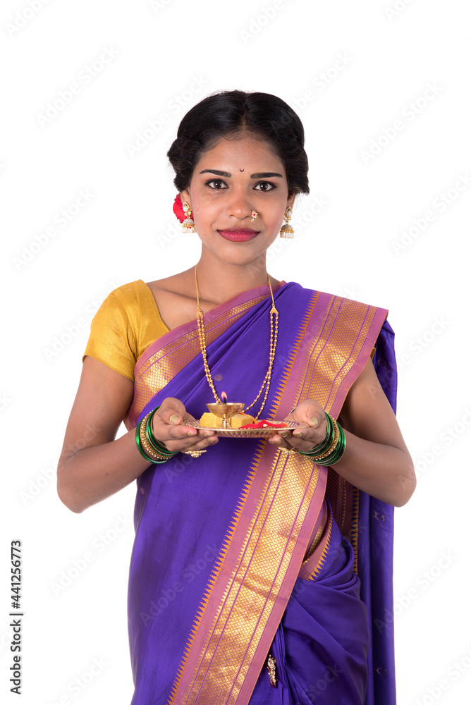 Indian woman performing worship, portrait of a beautiful young lady ...