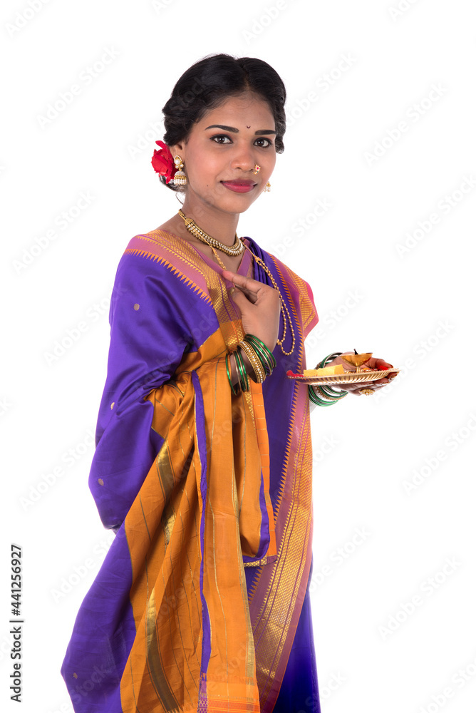 Indian woman performing worship, portrait of a beautiful young lady ...