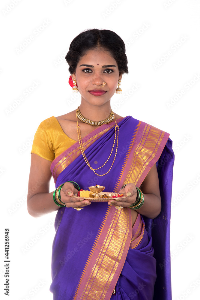 Indian woman performing worship, portrait of a beautiful young lady ...