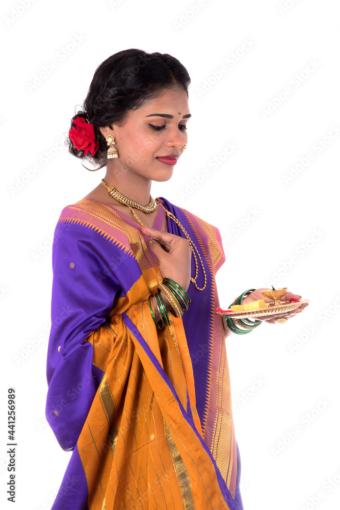Indian woman performing worship, portrait of a beautiful young lady ...