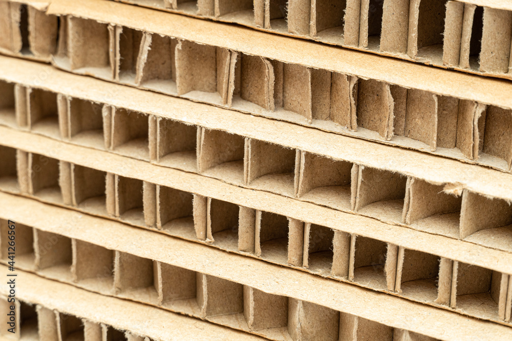 cut of honeycomb cardboard pack stack with large cells close-up as a ...