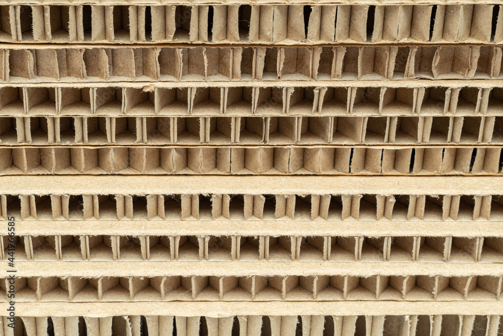 cut of honeycomb cardboard pack stack with large cells close-up as a ...