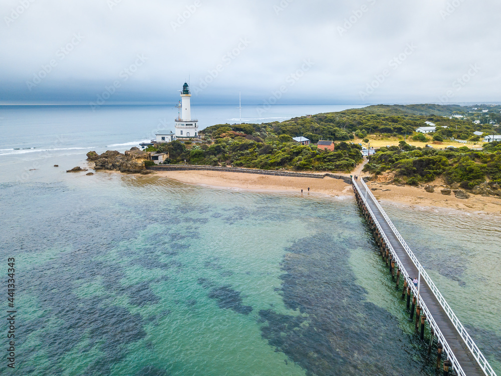 Aerial view of a jetty leading to a lighthouse on a coastline Stock ...