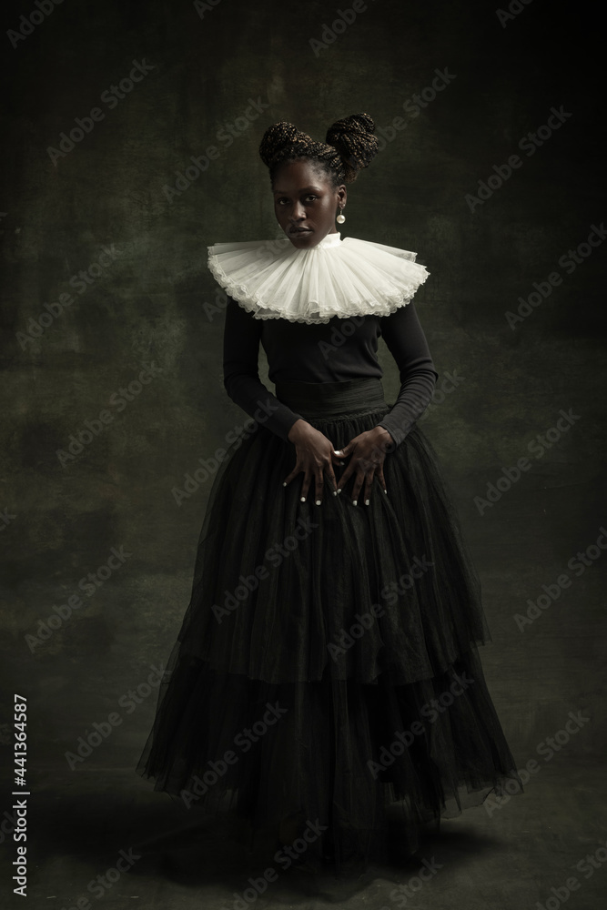 Medieval African young woman in black vintage dress with big white ...