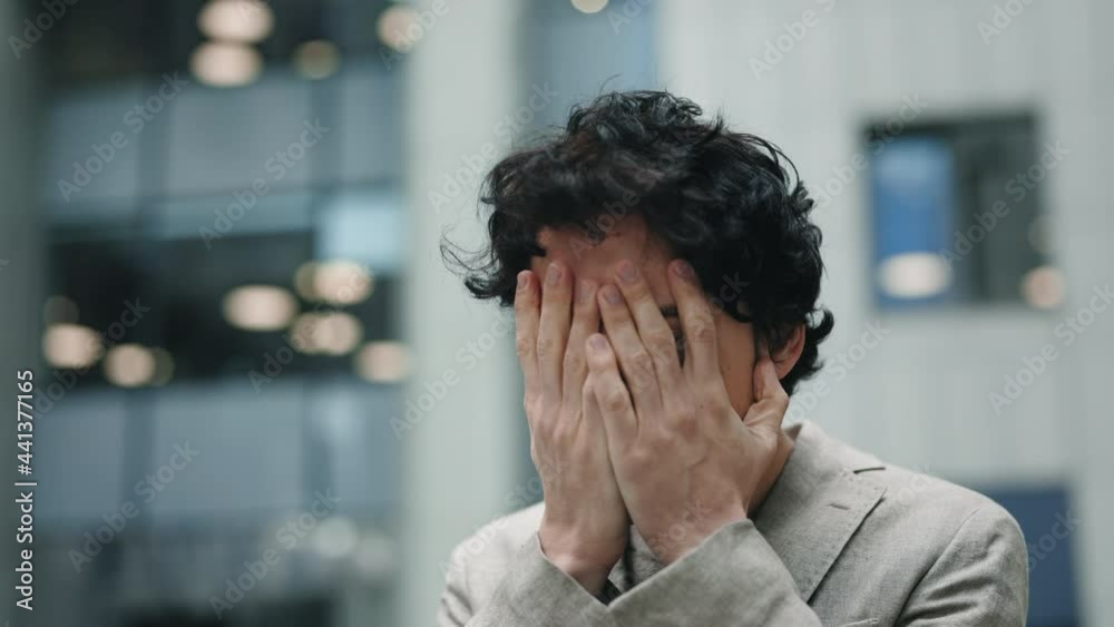 Oh no. Portrait view of the brunette caucasian sad man closed his face ...