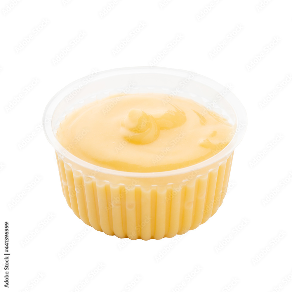 Portion of mayonnaise in a plastic box, angled view, isolated on white ...