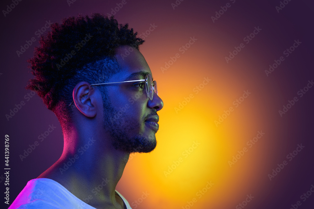 Portrait of a young african man at studio. High Fashion male model in ...