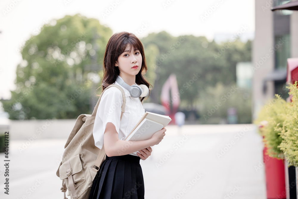 Outdoors, pretty beautiful Asian female college student Stock Photo ...