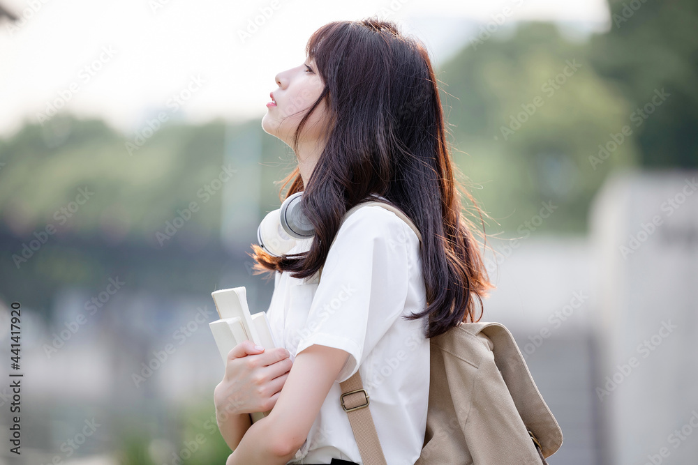 Outdoors, pretty beautiful Asian female college student Stock Photo ...
