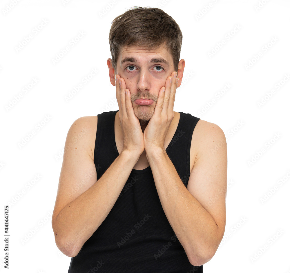 Young handsome tall slim white man with brown hair is sad holding his ...